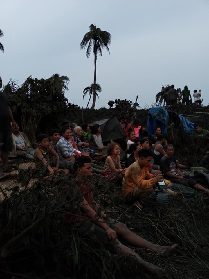 Island decimated by tsunami: Photos show emotional gathering of Mango ...